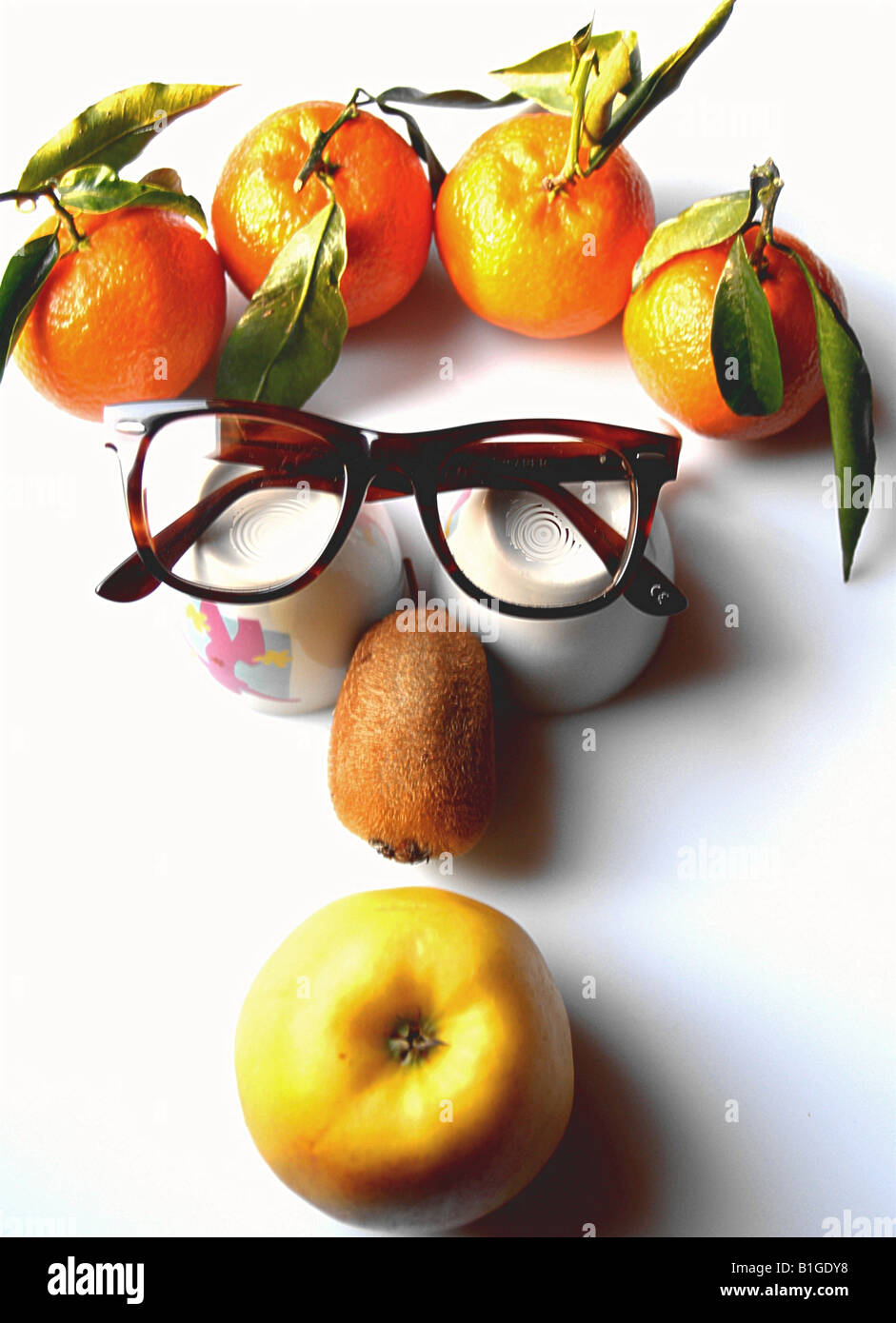 Overhead view of fruits and objects in shape of face Stock Photo - Alamy