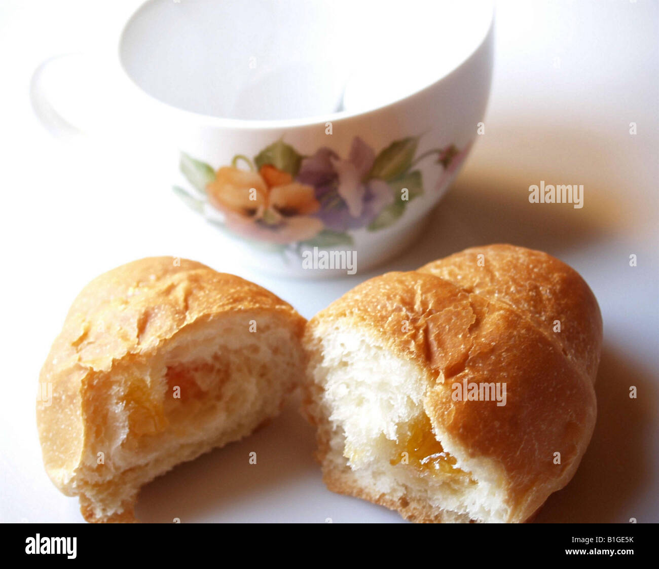 Closeup view of bread with cup Stock Photo - Alamy