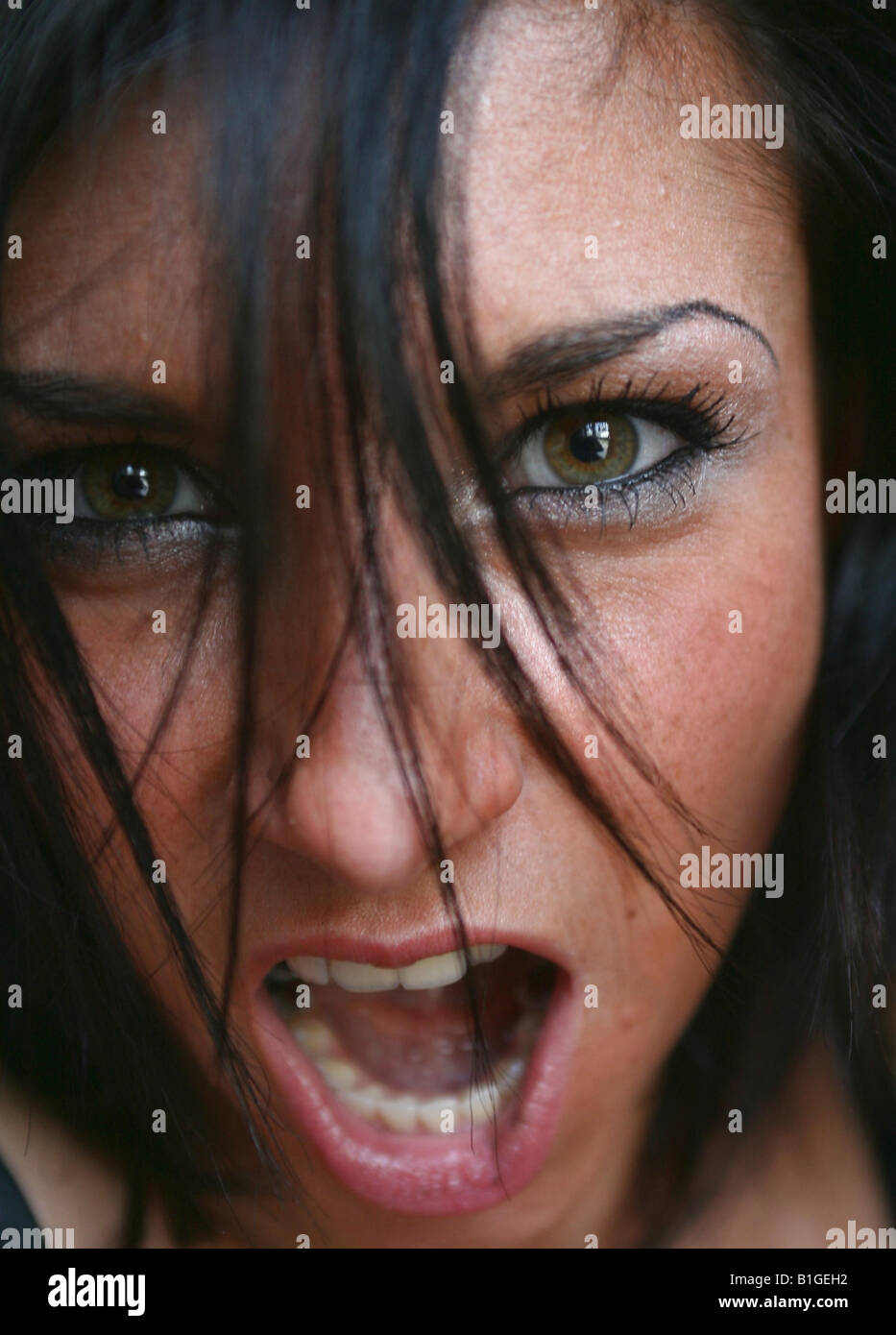 Headshot of a crazy woman Stock Photo - Alamy