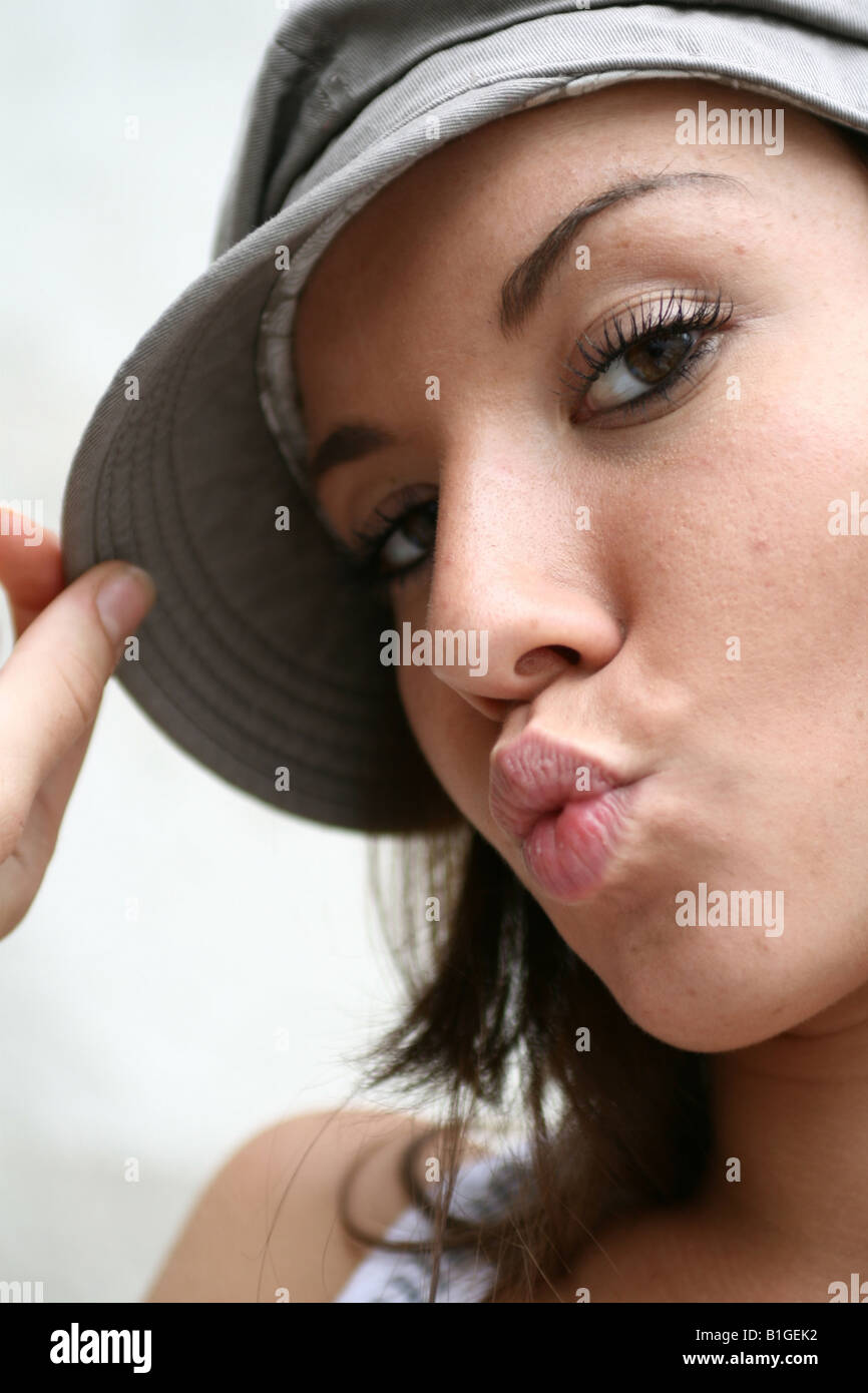 Headshot of a young woman puckering her lips Stock Photo - Alamy