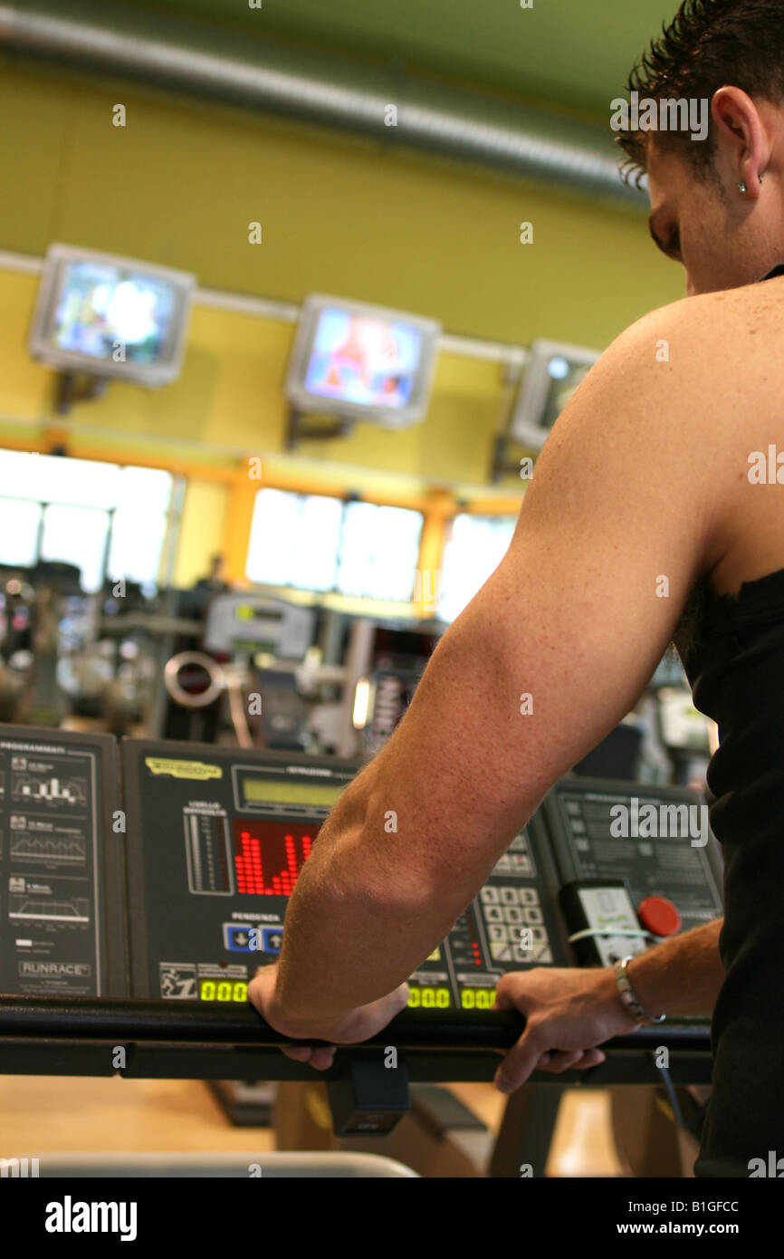 A man working out on exercise machine Stock Photo - Alamy