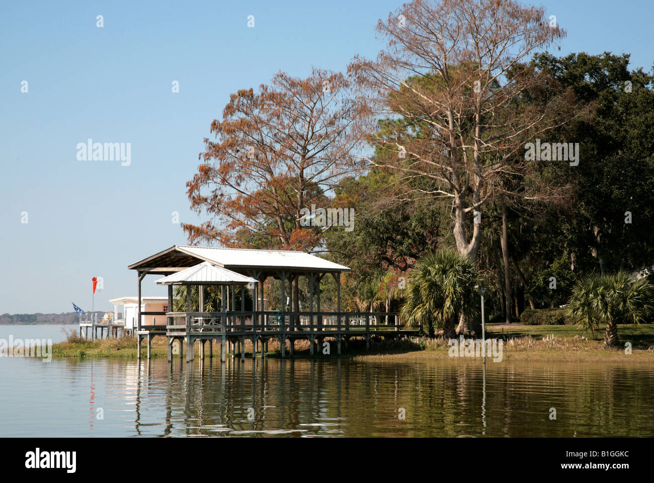 Wooden dock and deck on the shore of Lake Dora in Central Florida Stock ...