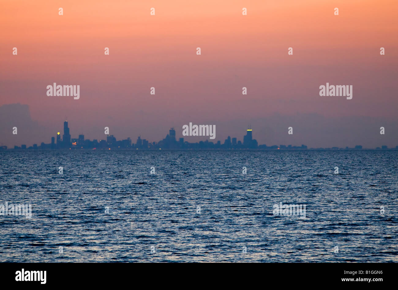 The skyline of Chicago, IL, as seen from across Lake Michigan at a park ...