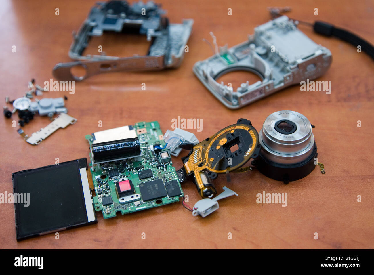 Photo of disassembled Nikon digital camera displaying all major ...