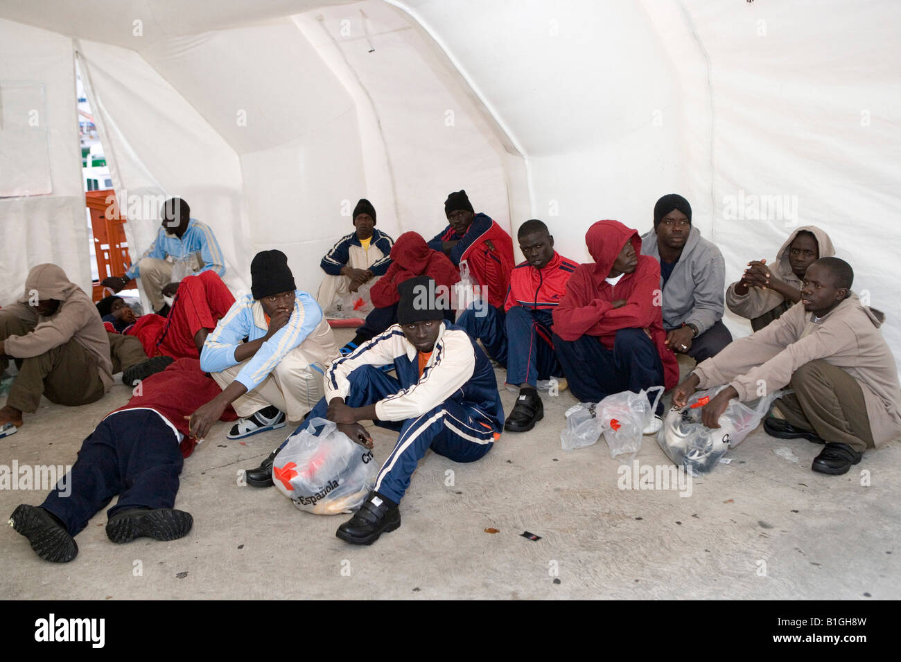 African refugees in a red cross first aid center Stock Photo - Alamy
