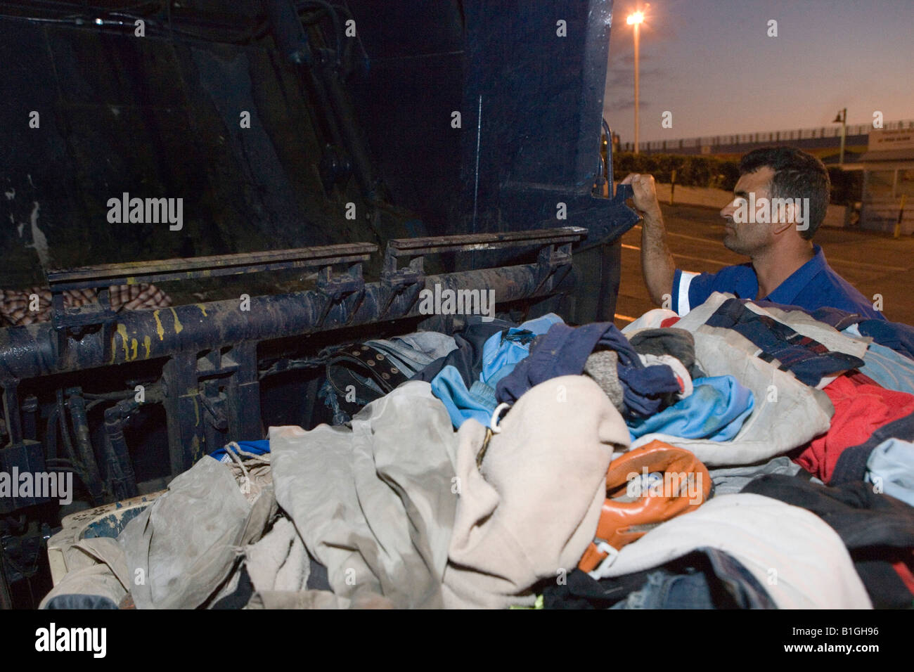 Employees Of The Refuse Disposal Service Dispose The Clothes Of Illegal Refugees Who Have employees-of-the-refuse-disposal-service-dispose-the-clothes-of-illegal-refugees-who-have