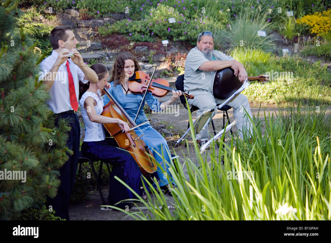 Group of people playing music at LU Botanical Garden Riga Latvia Stock ...