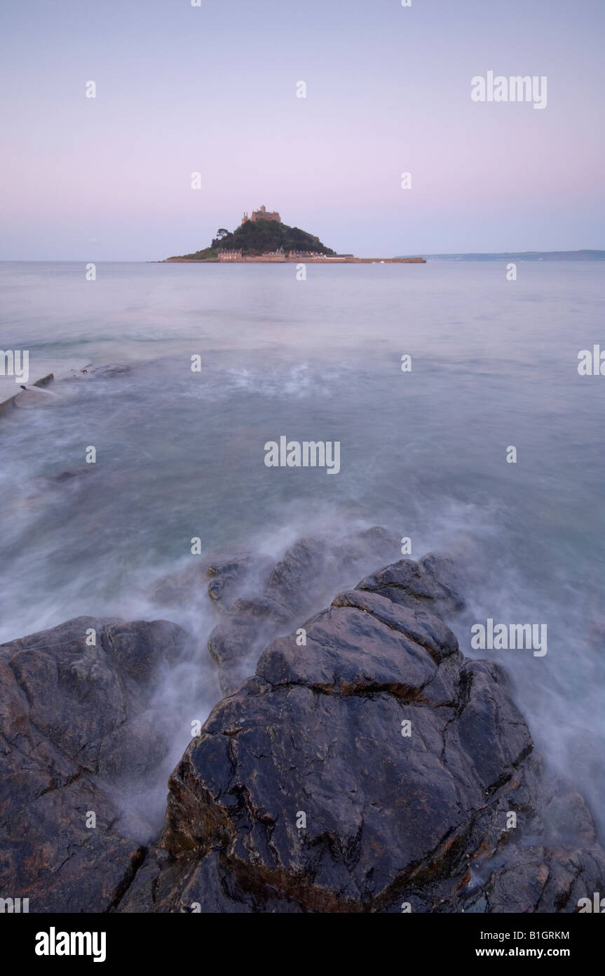 Waves washing in over foreshore rocks at St Michaels Mount at dawn ...
