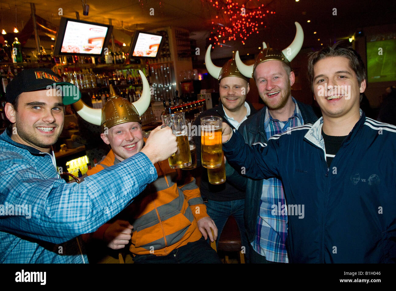 Young Icelandic men cheering at a bar in Reykjavik Iceland Stock Photo ...