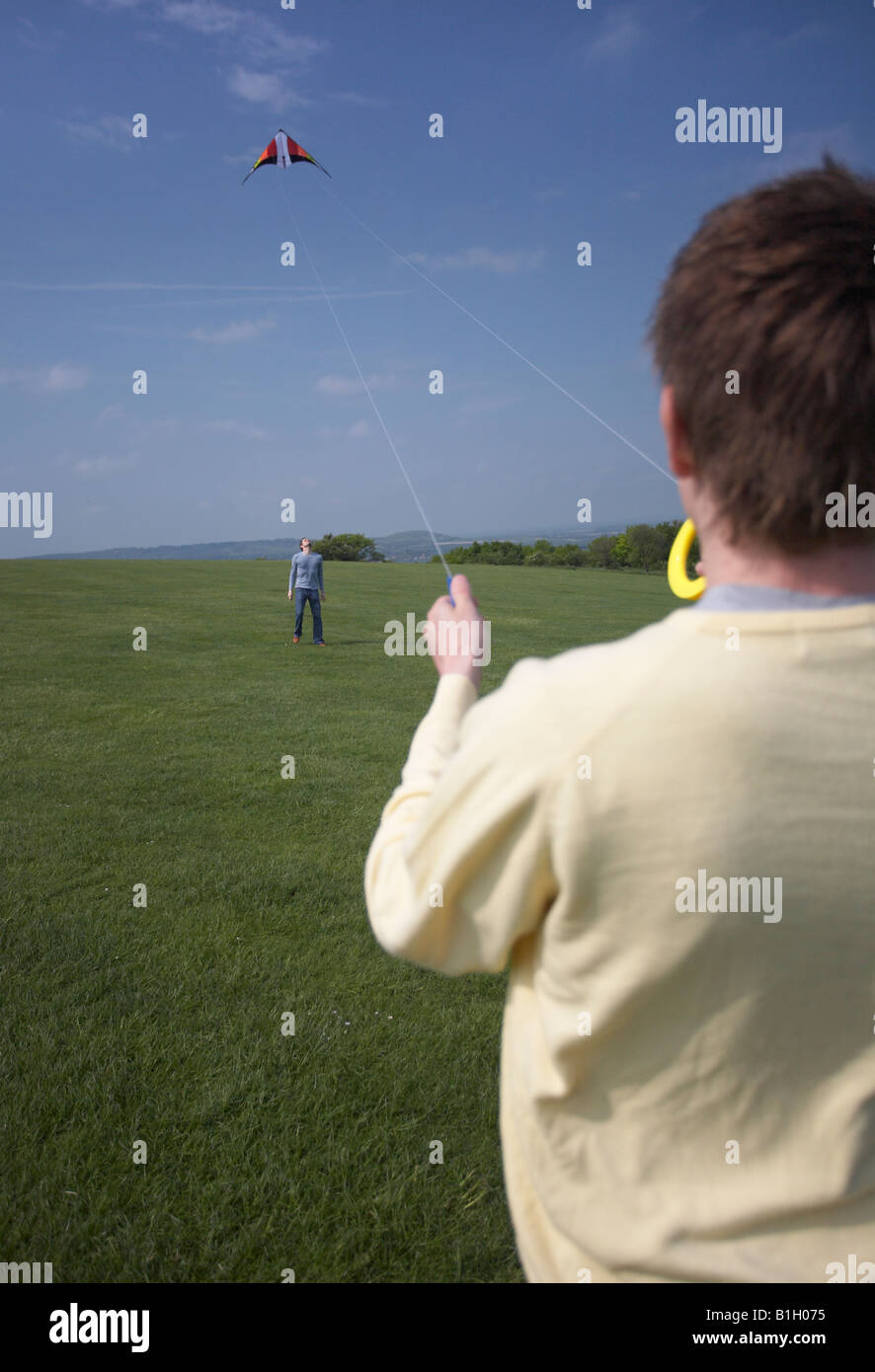 Man flying kite Stock Photo - Alamy