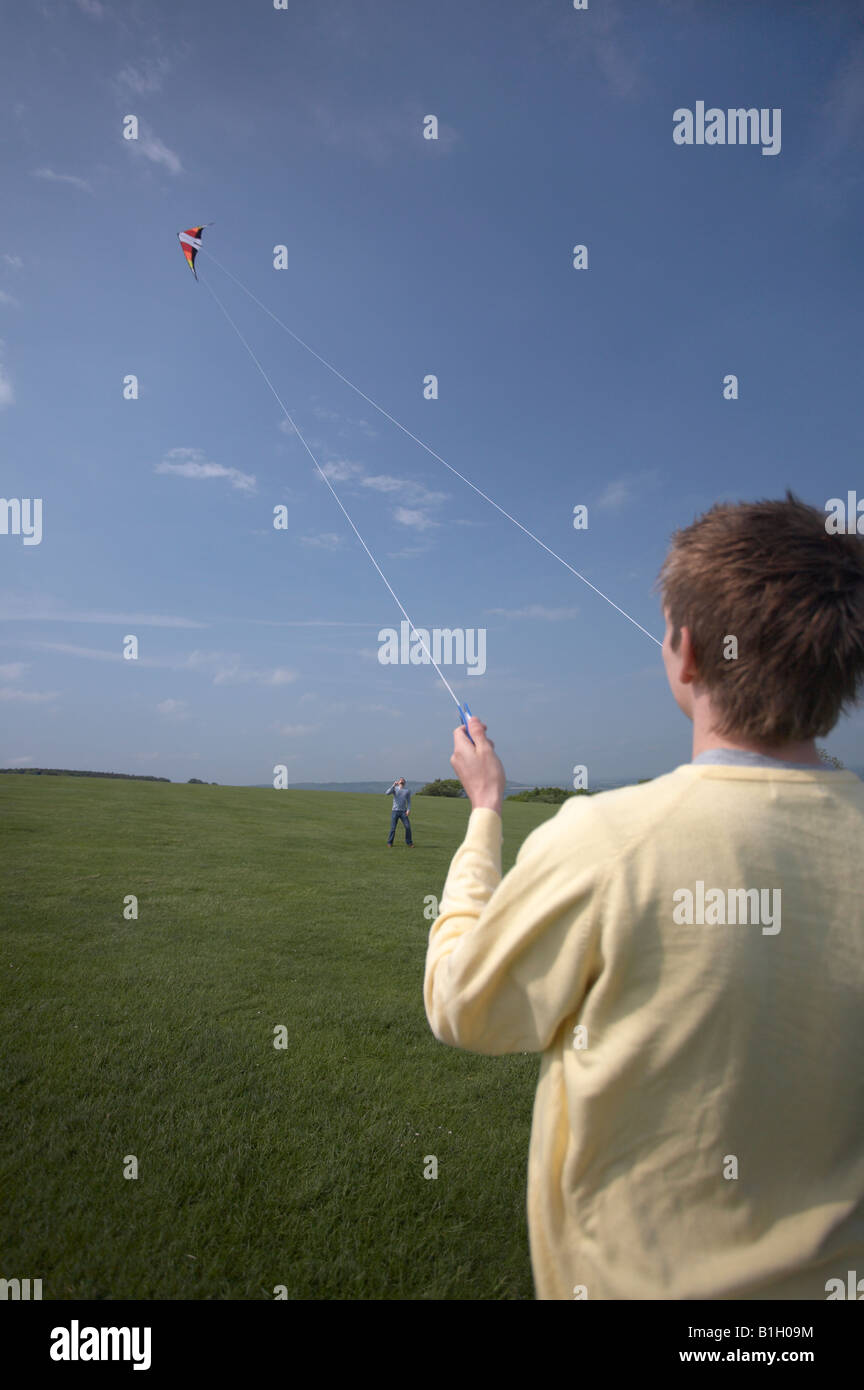 Man flying kite Stock Photo - Alamy
