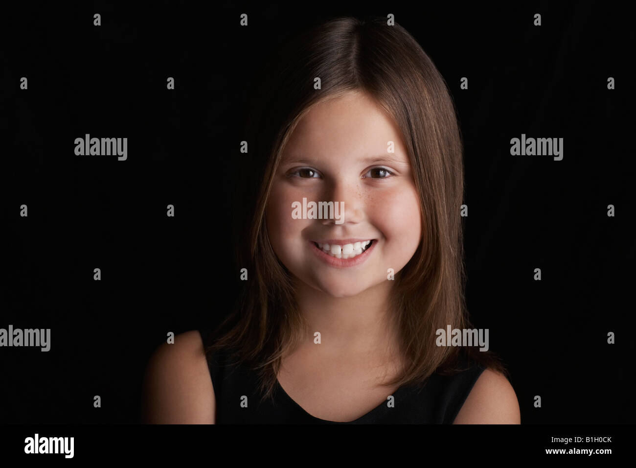 Girl (5-6) on black background, portrait Stock Photo - Alamy