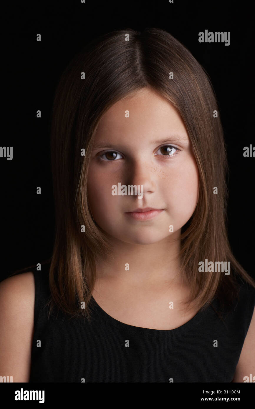Girl (5-6) on black background, portrait Stock Photo - Alamy