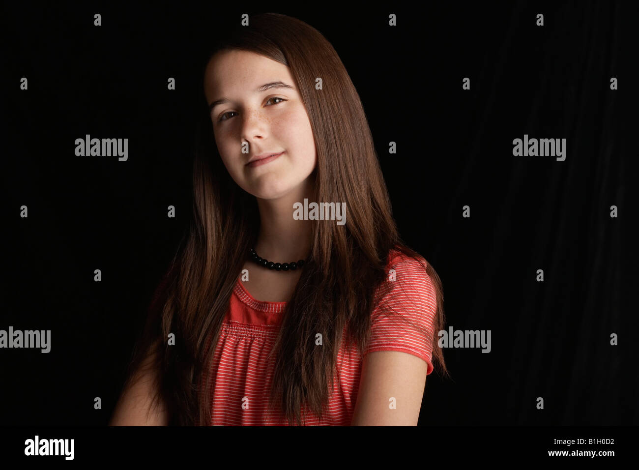 Girl (13-15) on black background, portrait Stock Photo - Alamy