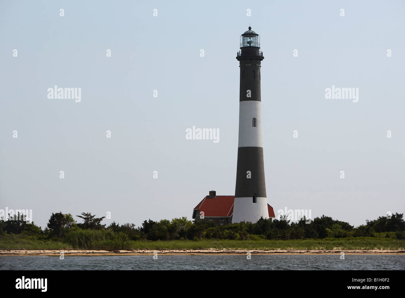 Beach and lighthouse Stock Photo - Alamy