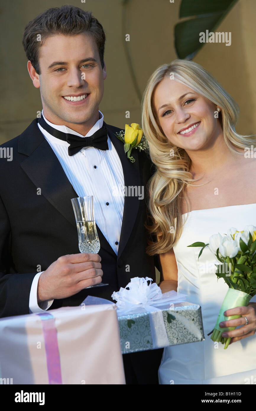 Bride and groom with wedding presents Stock Photo - Alamy