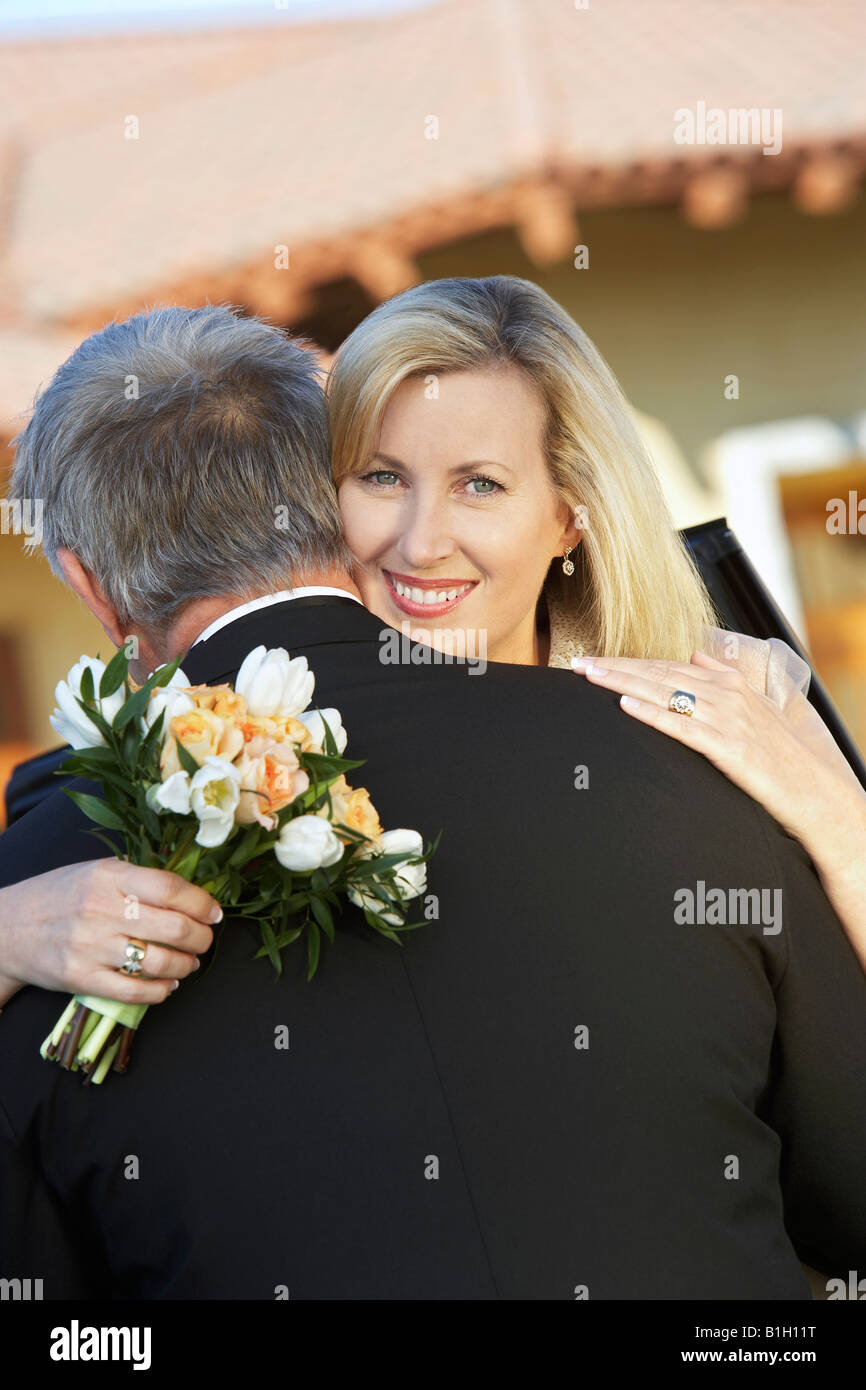 Middle-aged woman embracing man Stock Photo - Alamy