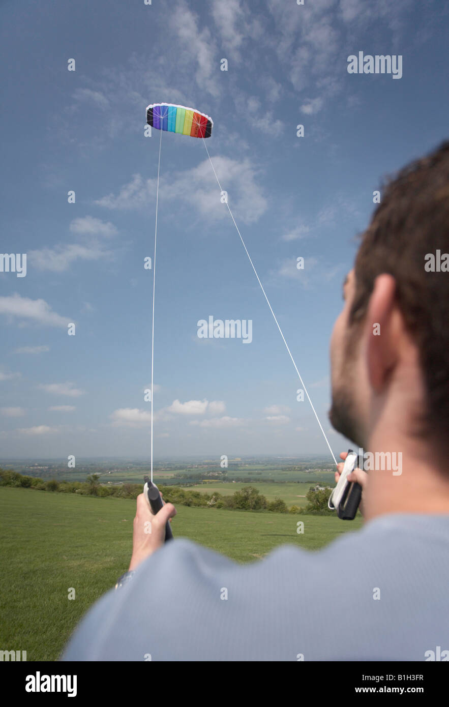 Man flying kite Stock Photo - Alamy