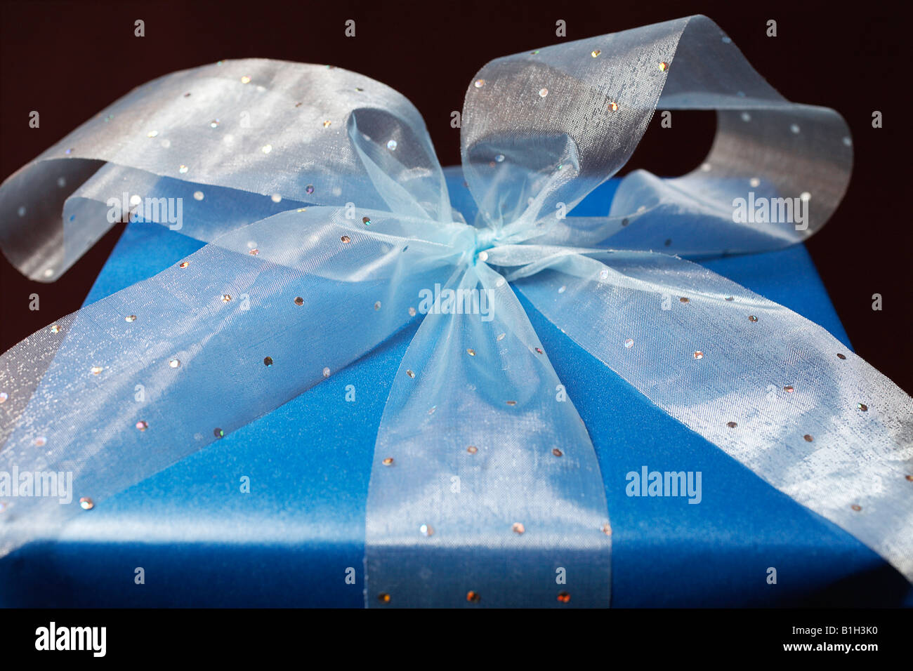 Present with ribbon, close-up Stock Photo - Alamy
