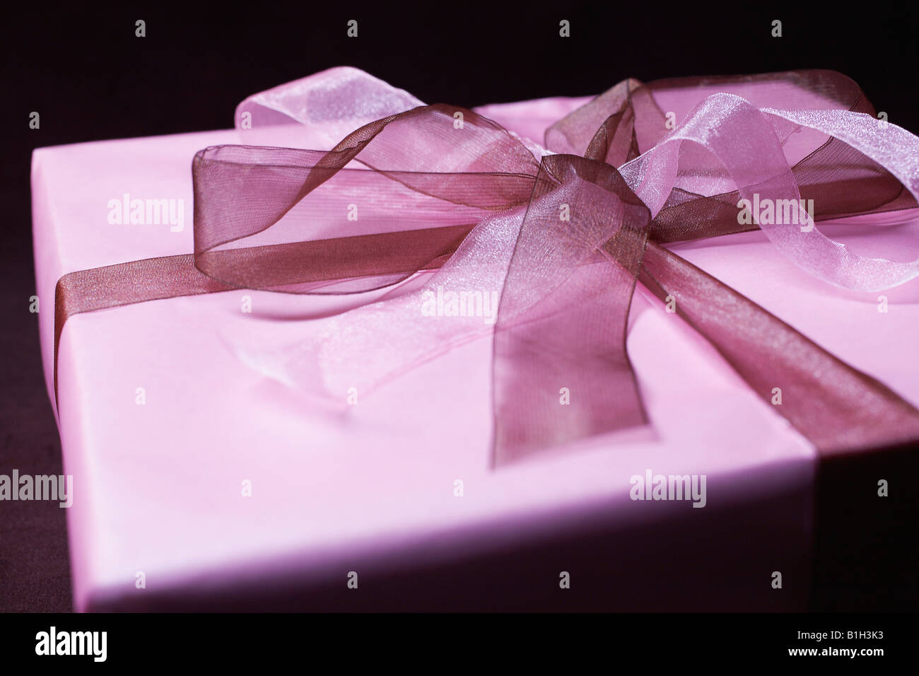 Present with ribbon, close-up Stock Photo - Alamy