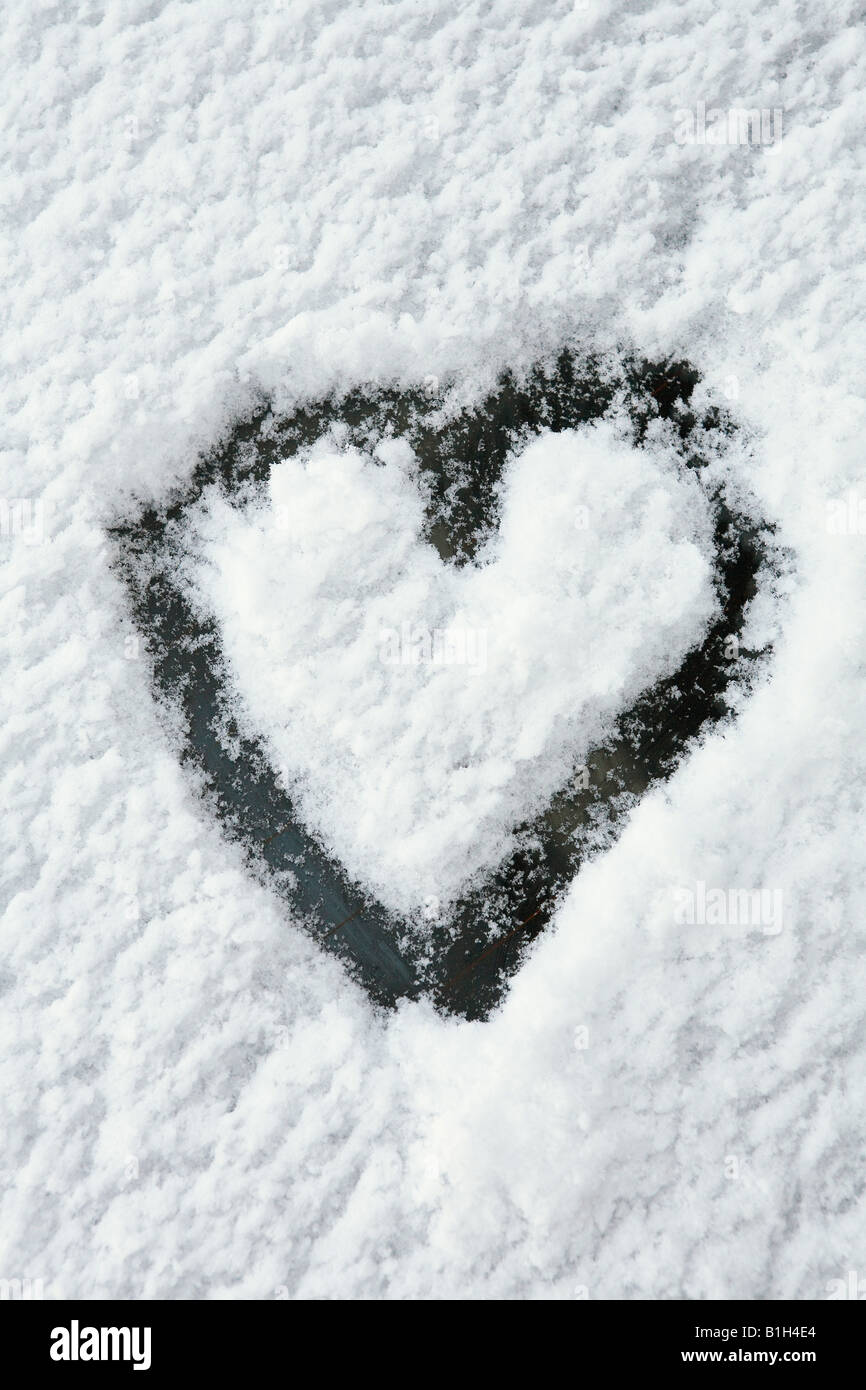 Heart in snow Stock Photo - Alamy