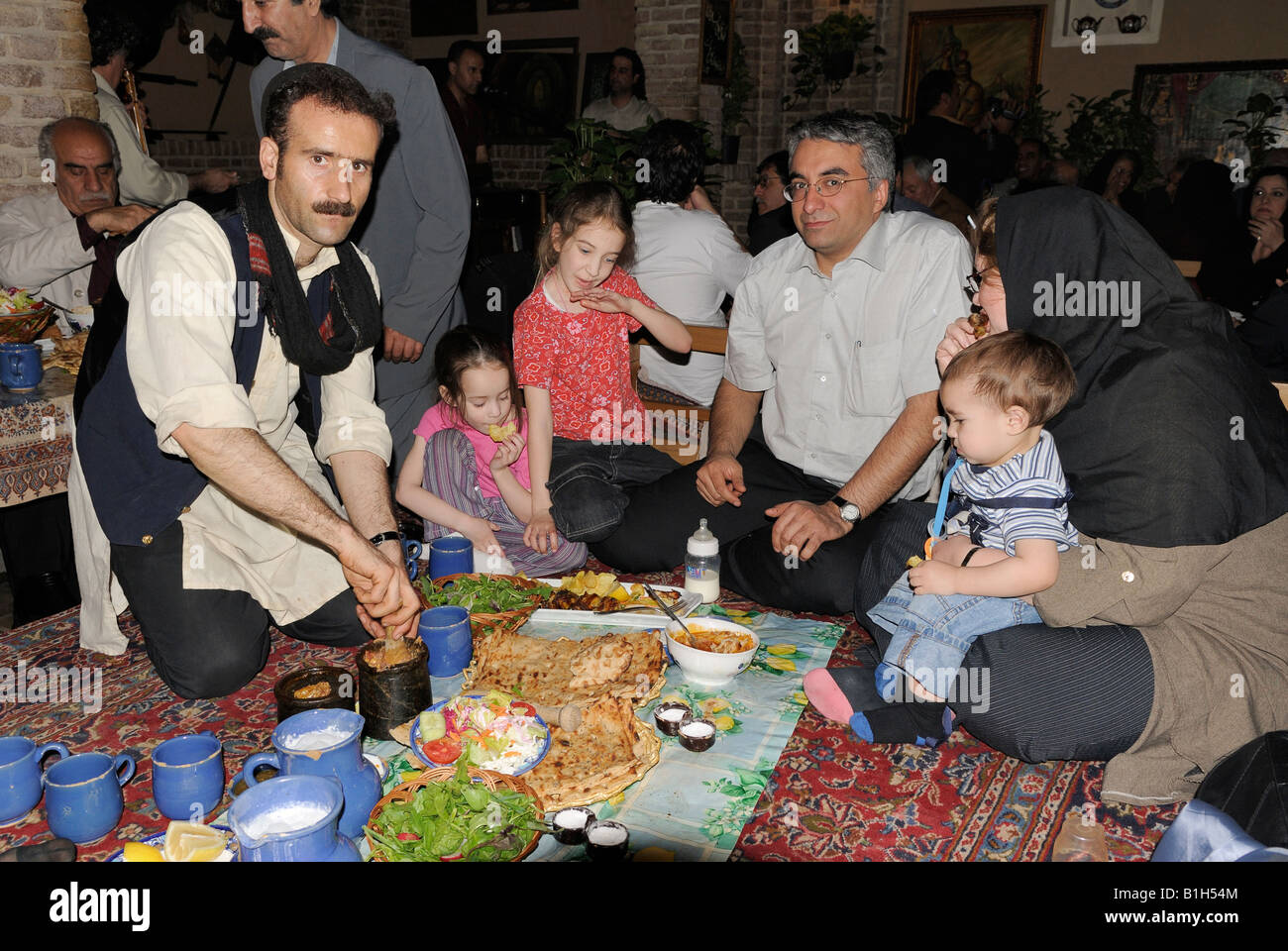 Family dining out at a local restaurant in Terahan city, Iran and ...