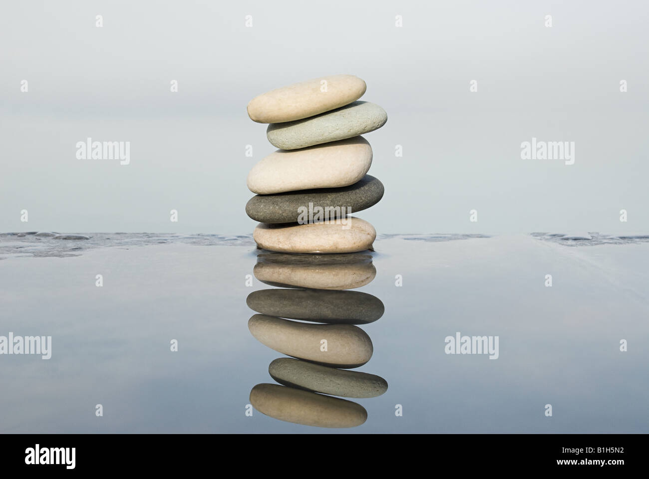 Stack of pebbles and water Stock Photo - Alamy