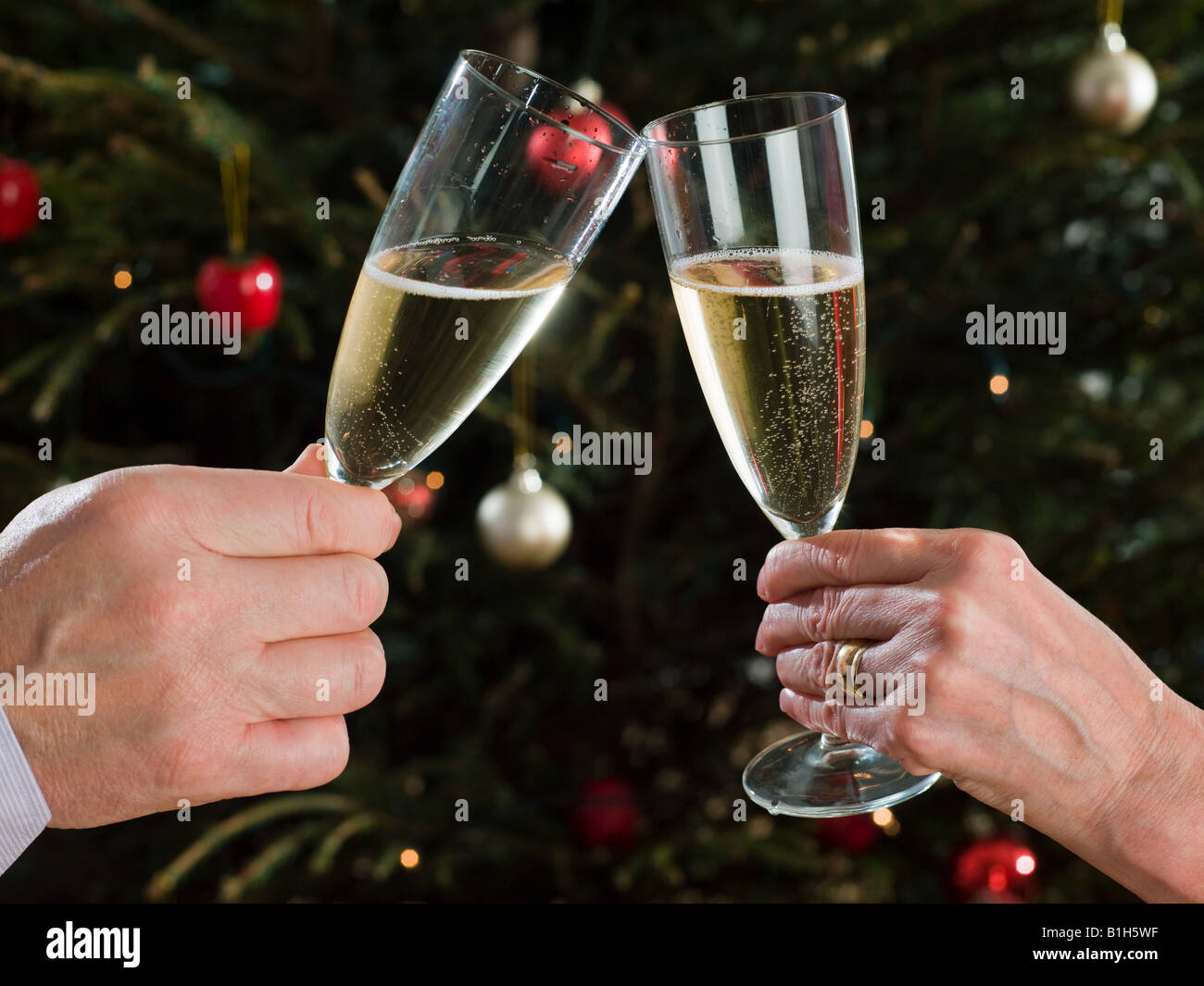 Couple toasting with champagne Stock Photo - Alamy