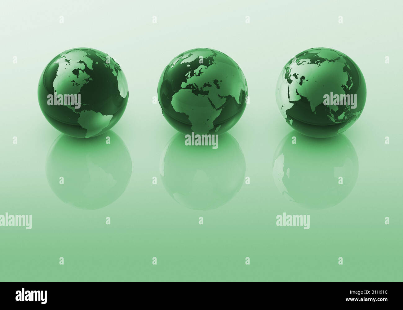 Three green globes Stock Photo - Alamy