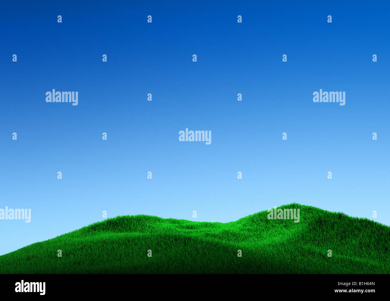 Grassy hill and blue sky Stock Photo - Alamy