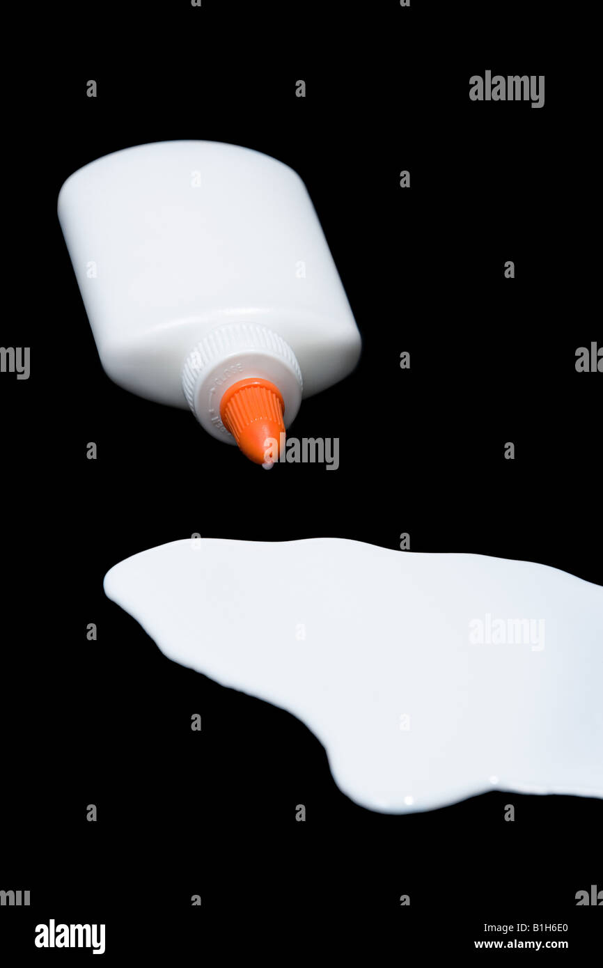 Glue spilling out of a bottle Stock Photo - Alamy