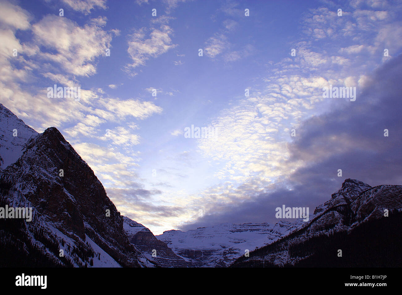 Clouds over snow covered mountains, Mount Victoria, Victoria Glacier ...