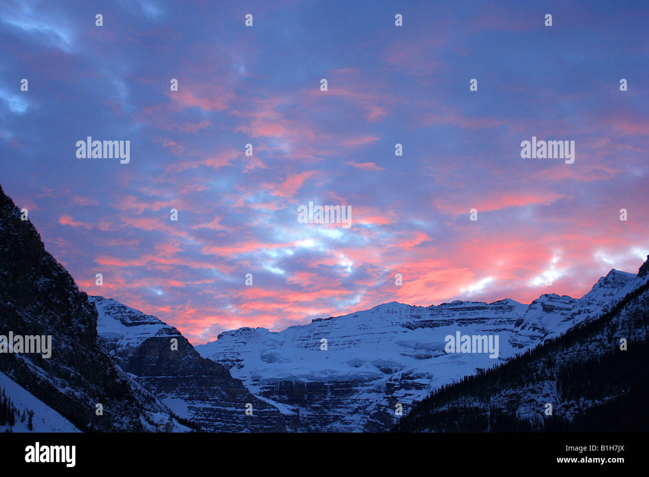 Sunset over snow covered mountains, Mount Victoria, Victoria Glacier ...