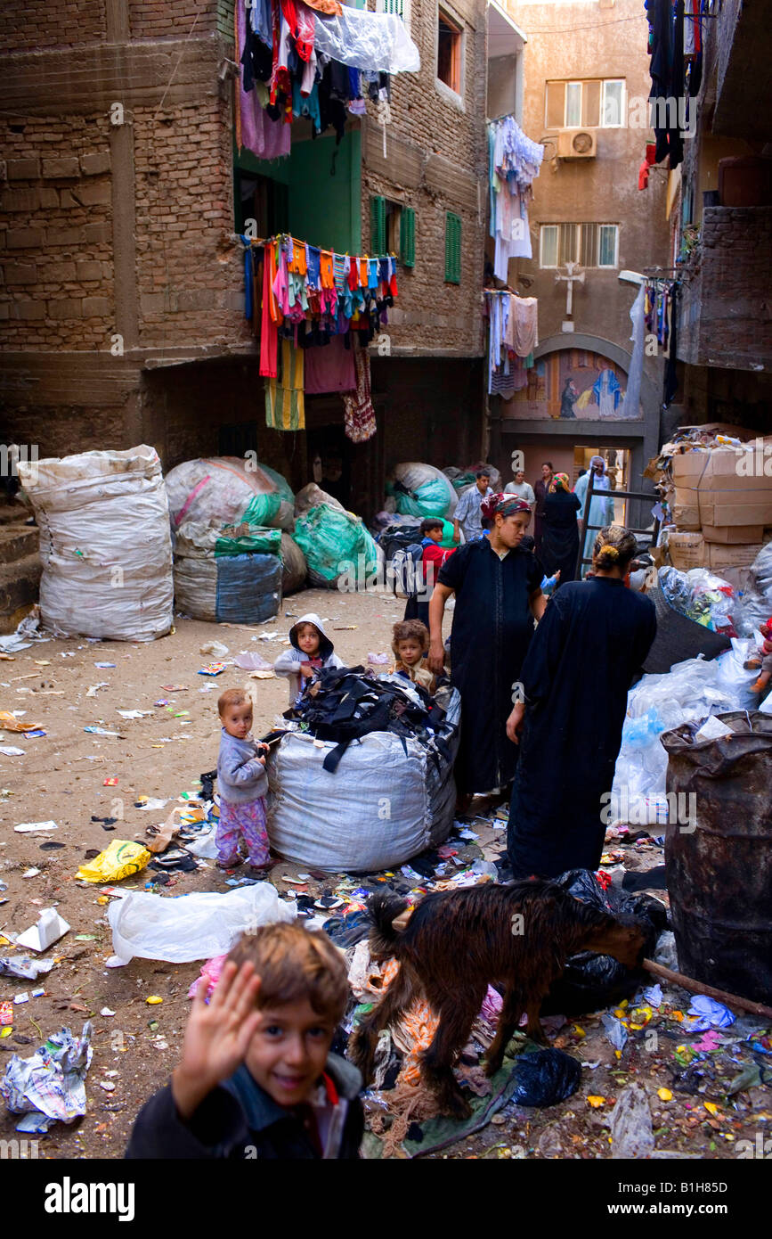 Zabaleen women sort through heaps of rubbish in the street Stock Photo ...
