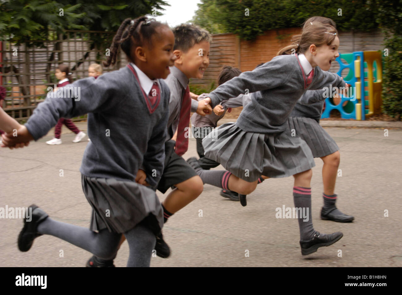 group of children running in the playground of a private school Stock ...