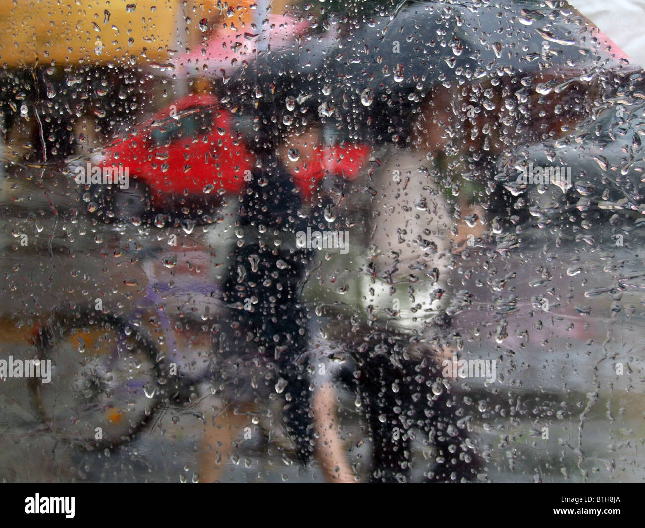 abstract street scene with rain drops on window Stock Photo - Alamy
