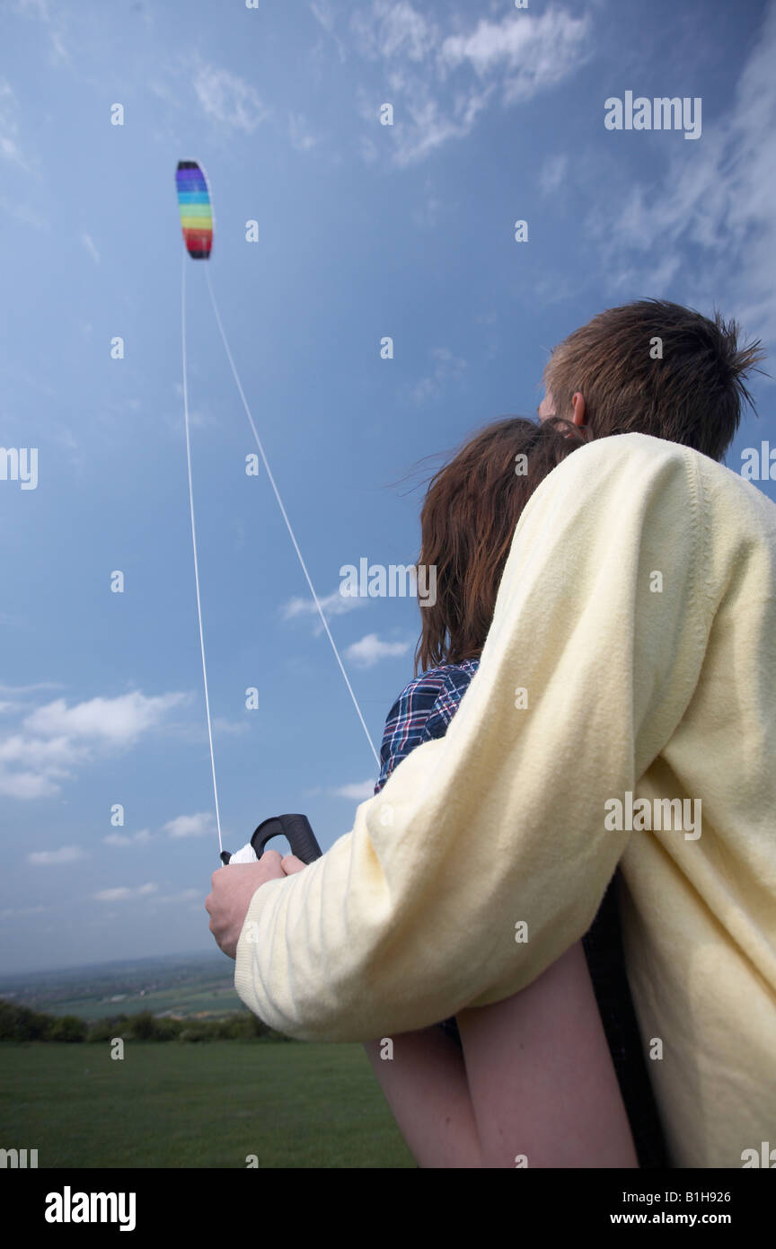 Young couple flying kite Stock Photo - Alamy