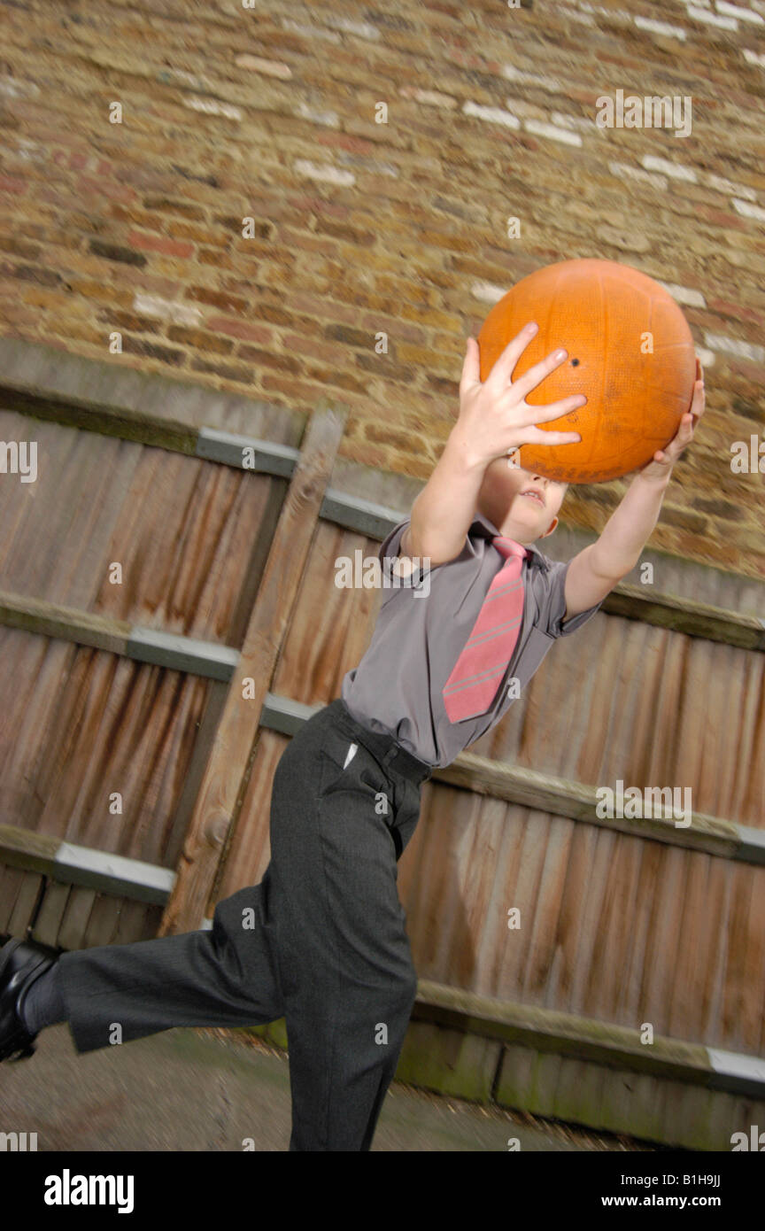 boy catching a ball in the playground at school Stock Photo - Alamy