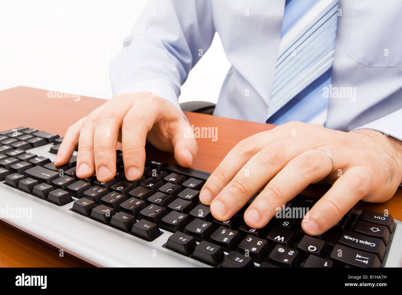 Man typing in the computer keyboard Stock Photo - Alamy