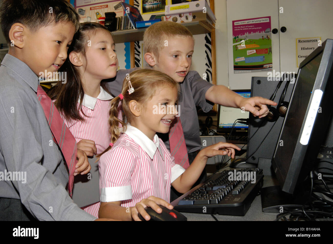 children in school learning on computers Stock Photo - Alamy