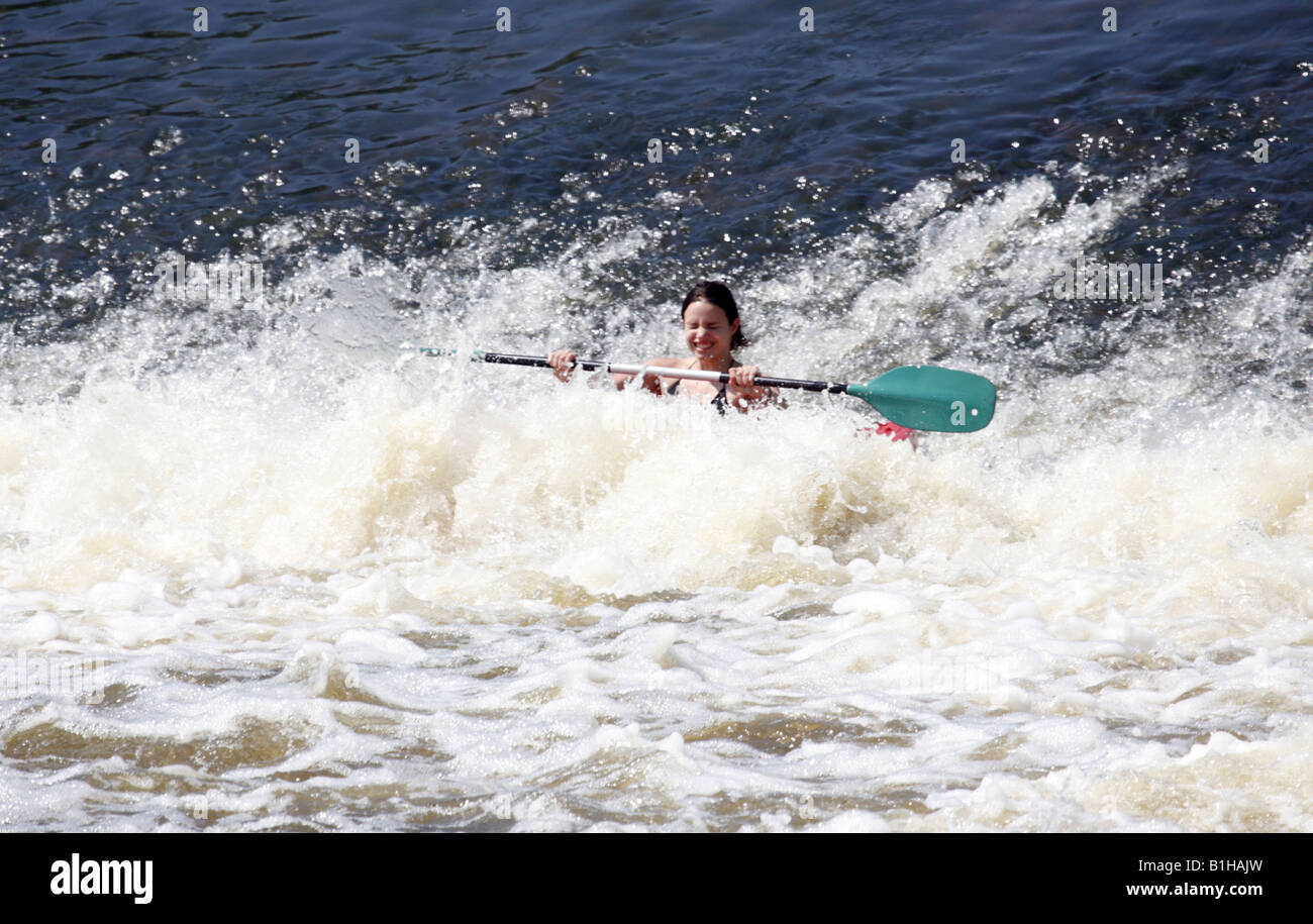 Young Woman in Kayak Shooting a Weir Stock Photo - Alamy