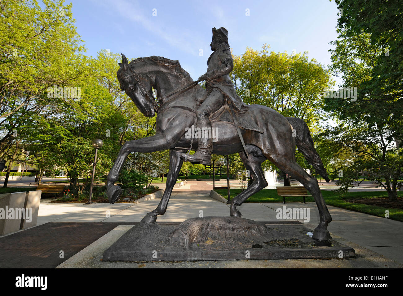 Homeless man reading book on park bench Stock Photo - Alamy