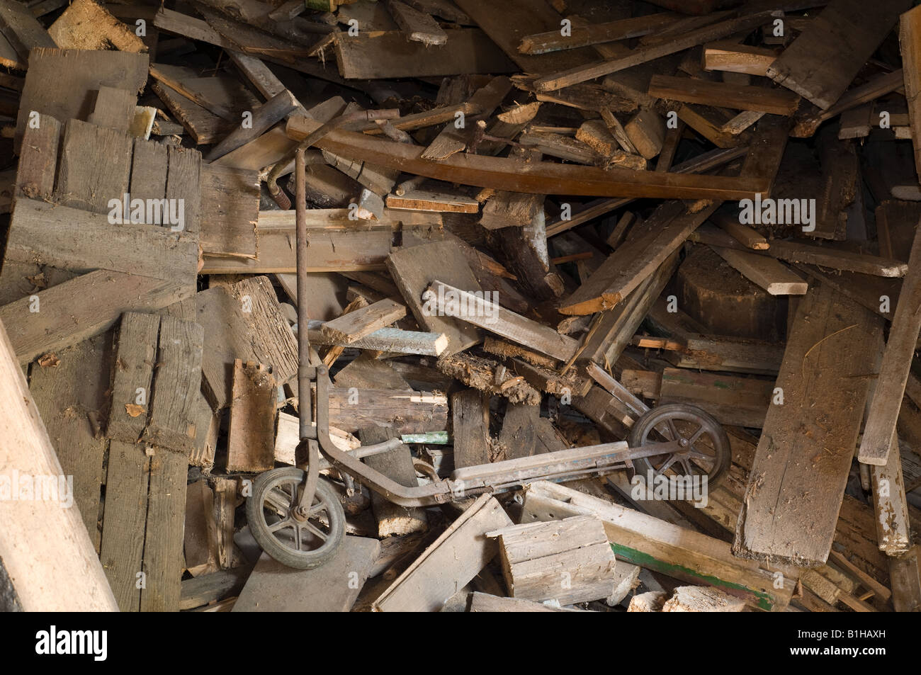 Lost childhood: an old children's scooter on a heap of junk Stock Photo ...