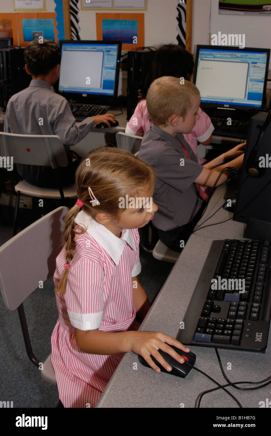 children in school learning on computers Stock Photo - Alamy
