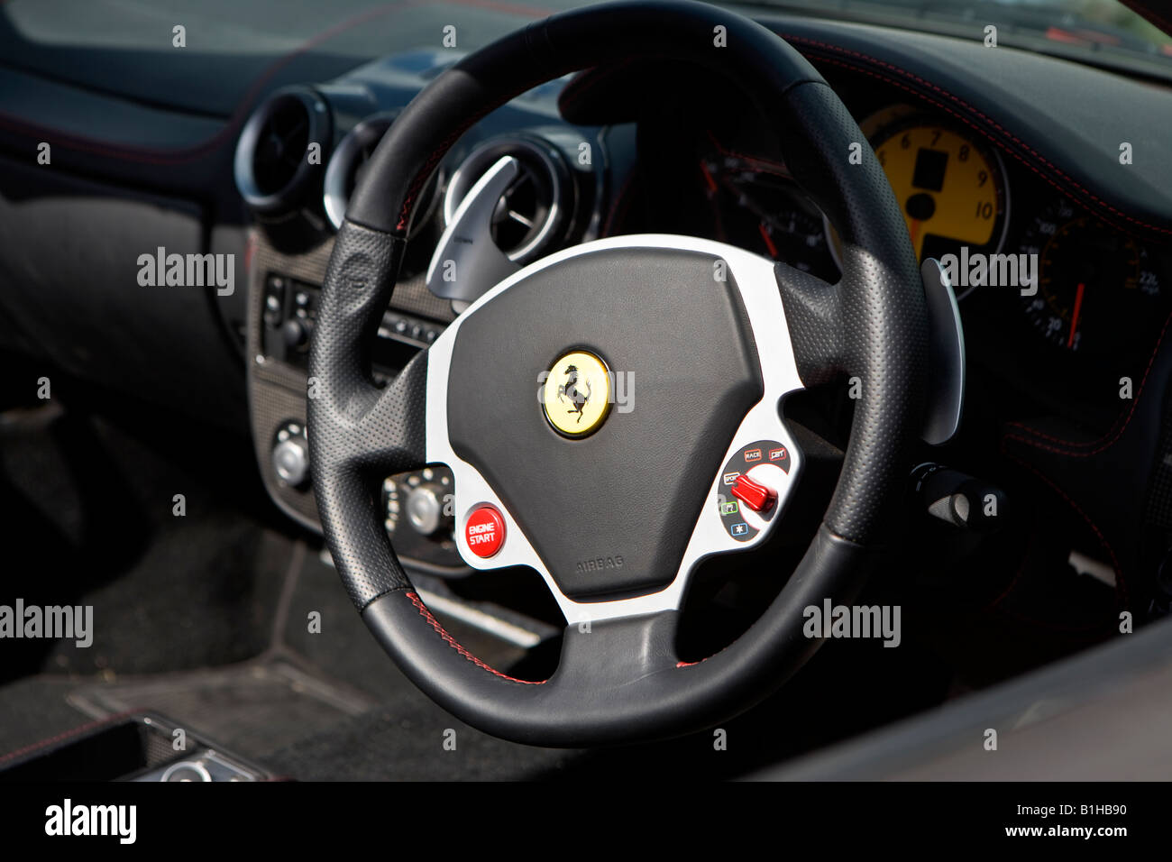 Red Ferrari F430 Steering wheel Stock Photo - Alamy