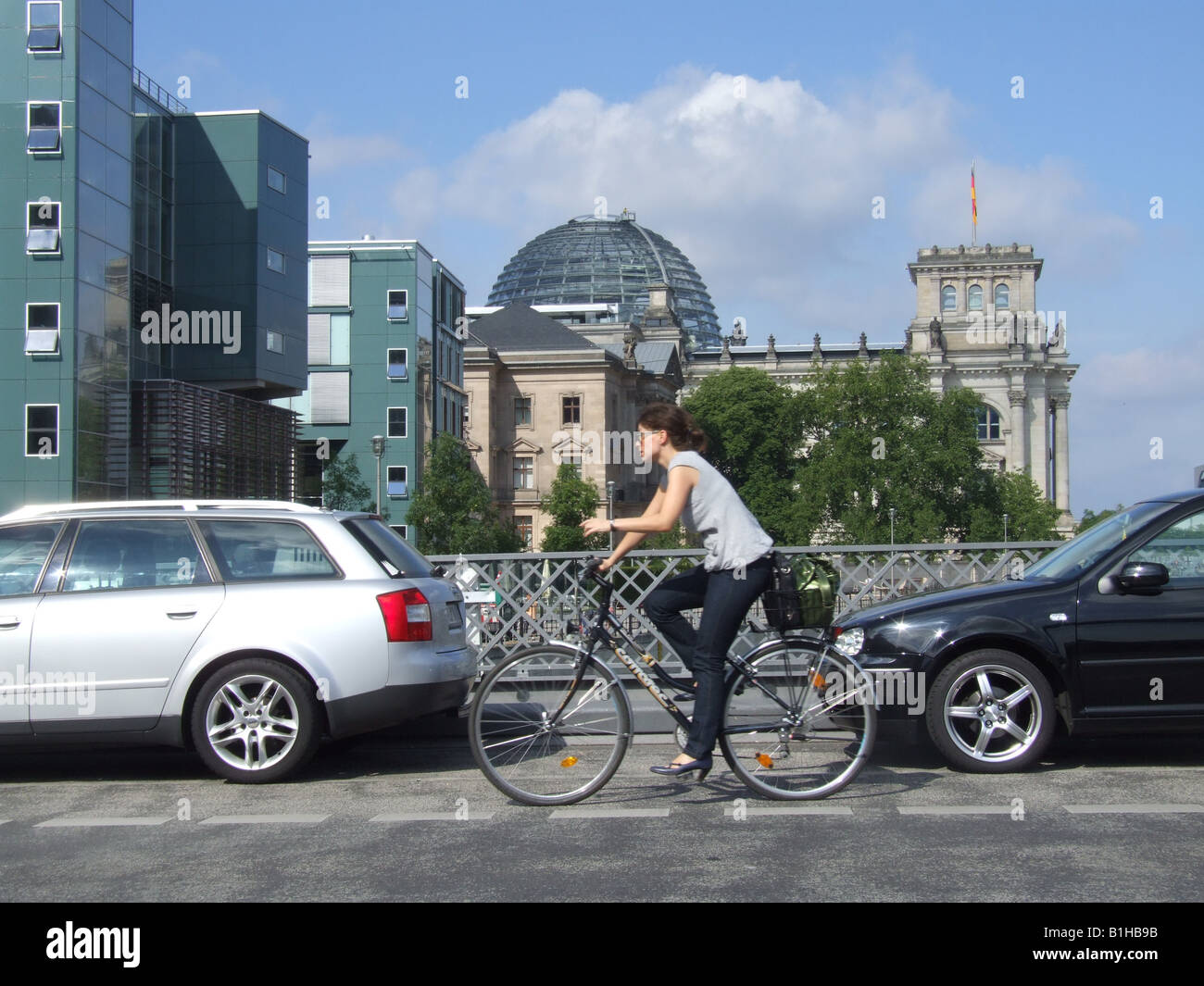 person riding bike reichstag dome, berlin, germany Stock Photo - Alamy