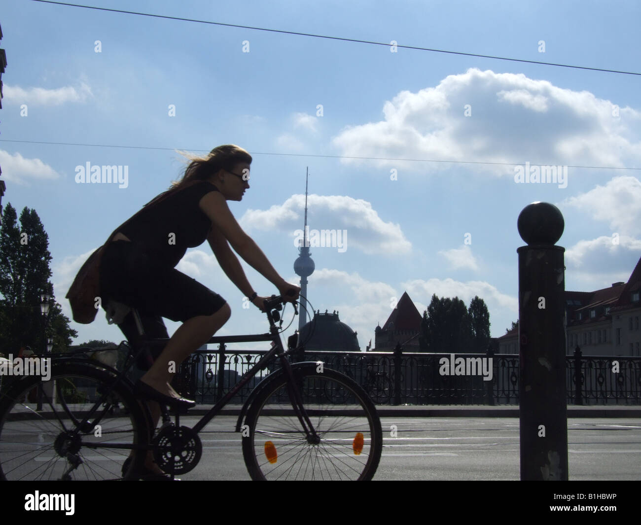 woman riding bike in berlin, germany Stock Photo - Alamy