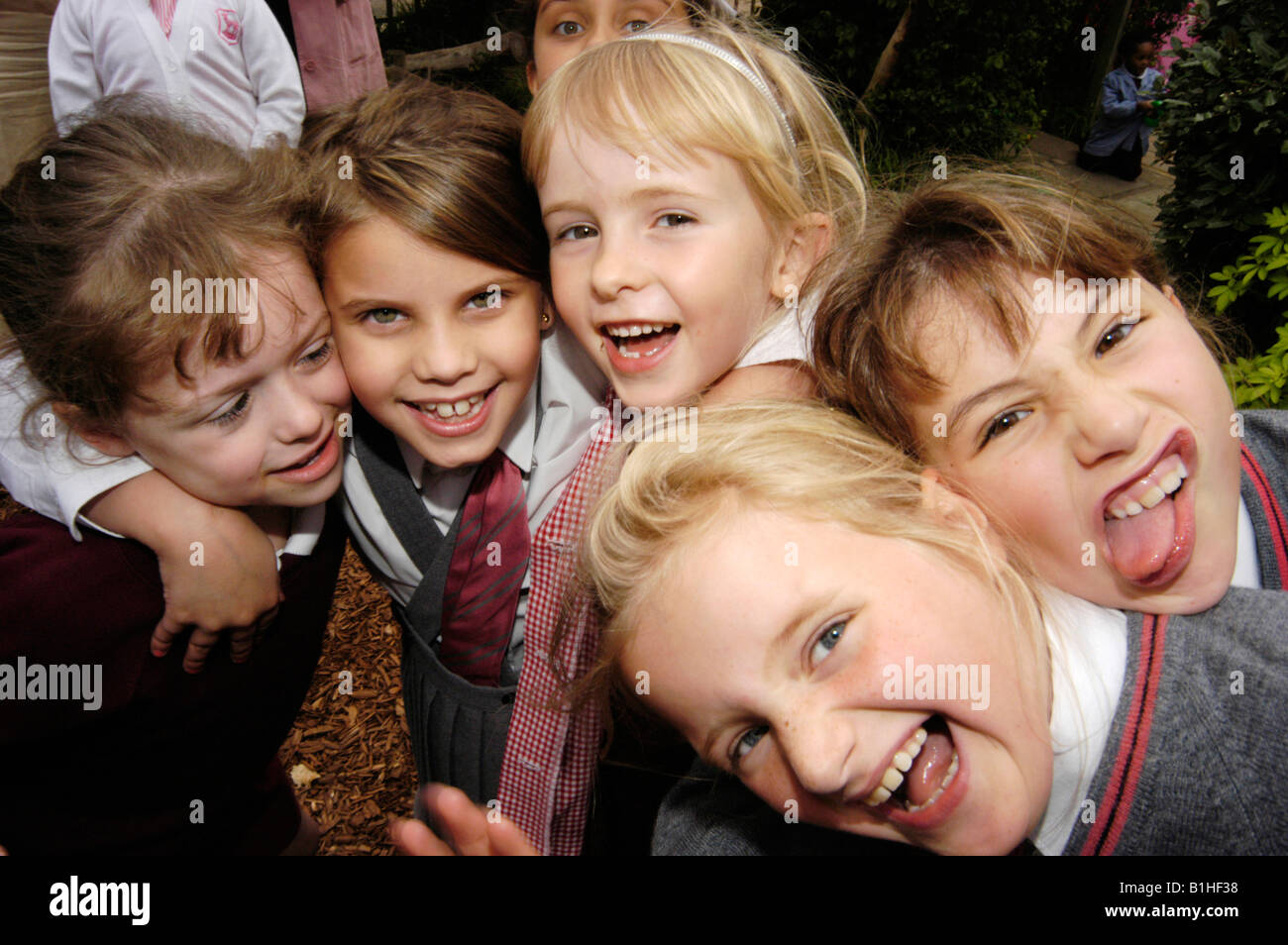 A group of school friends laughing and smiling together Stock Photo - Alamy