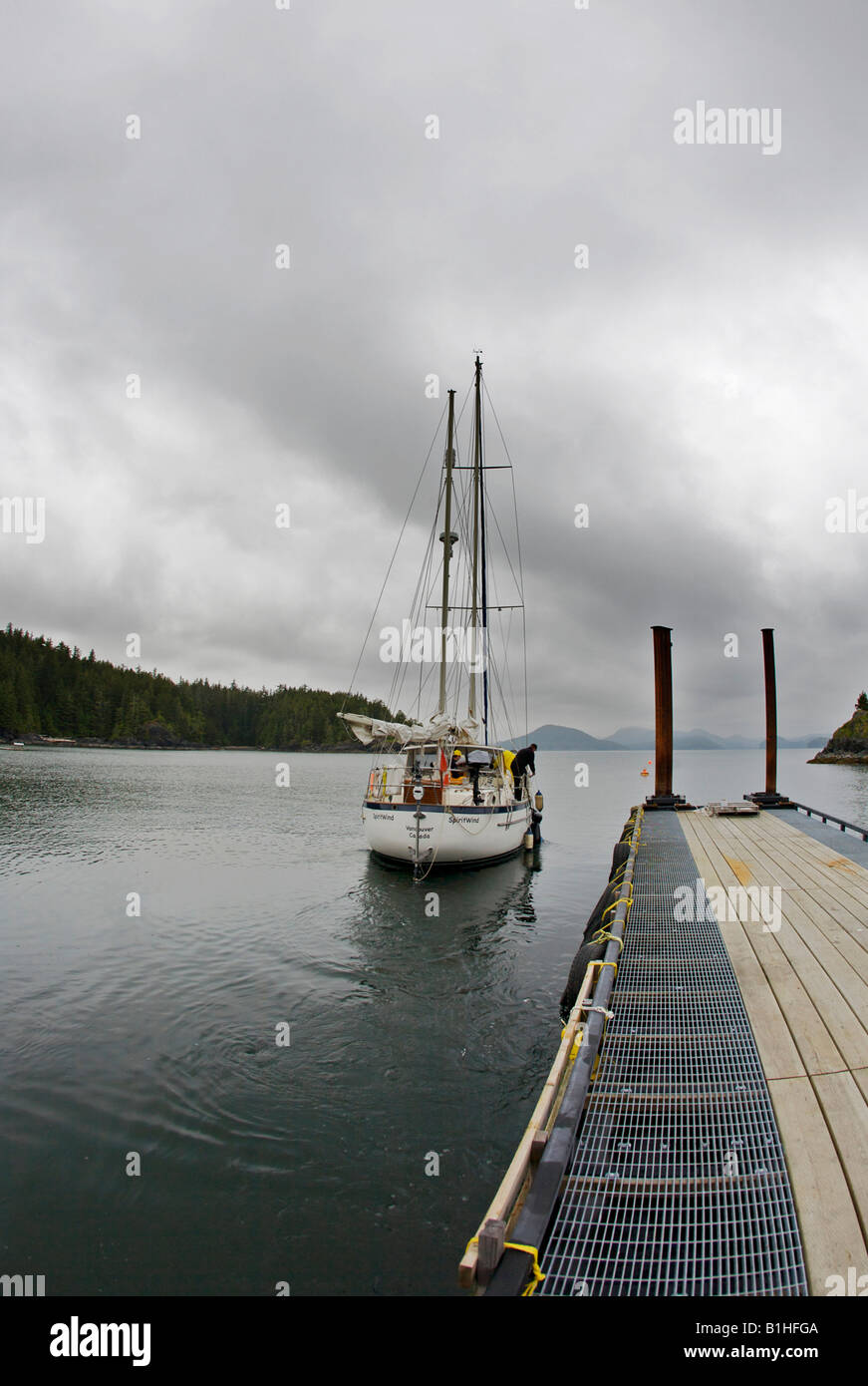 Friendly Cove, Vancouver Island. A Sailboat takes off for a trip down ...