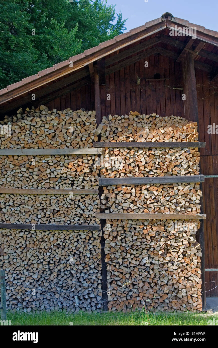 Firewood logs stacked outside a house in waging, Bavaria, Germany Stock ...
